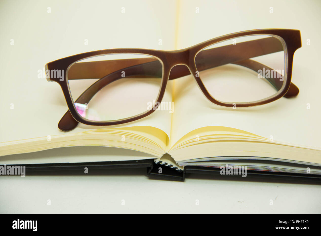 writing pen ready for taking notes on a notebook open paper glasses ...