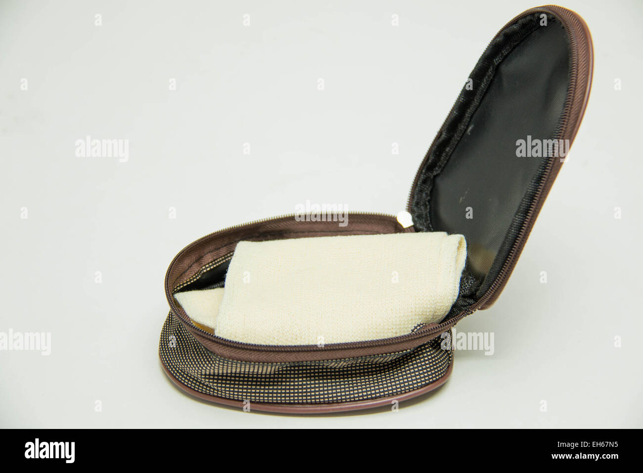 A Small leather empty open bag case Stock Photo - Alamy
