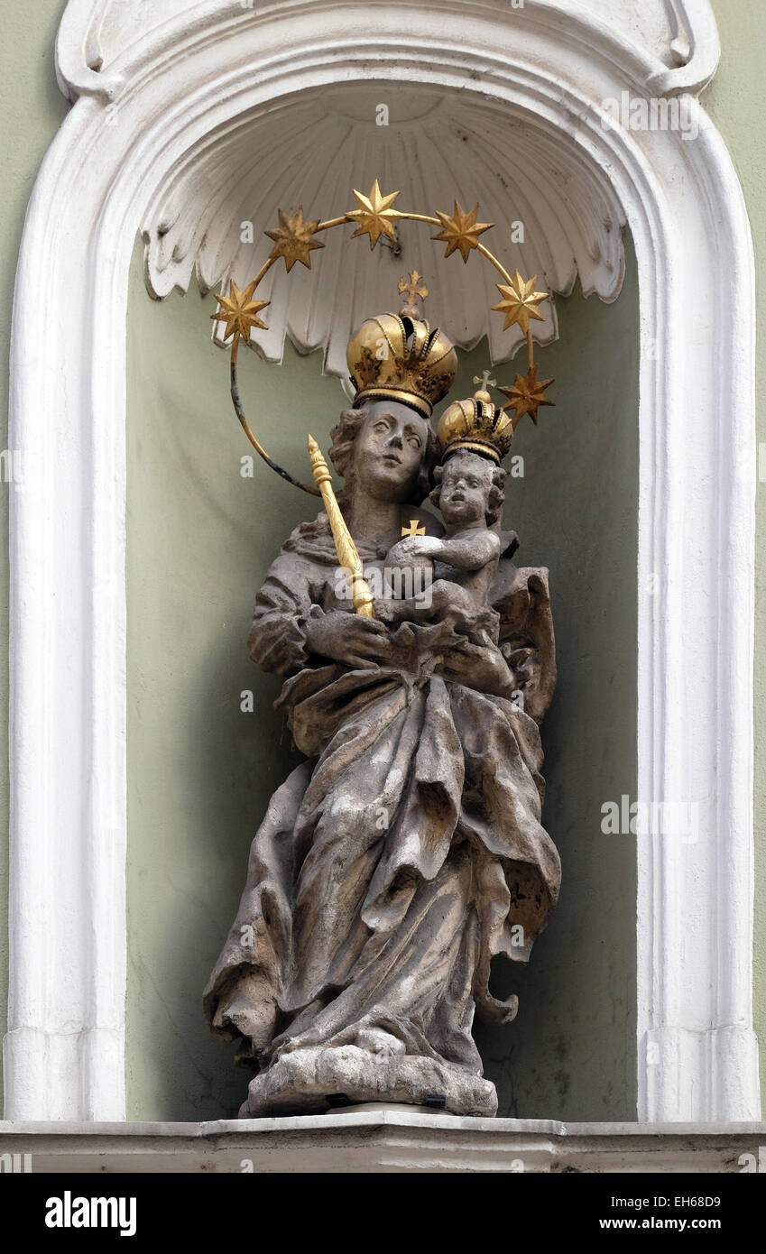 Virgin Mary with baby Jesus, statue on the house facade in Graz, Styria ...