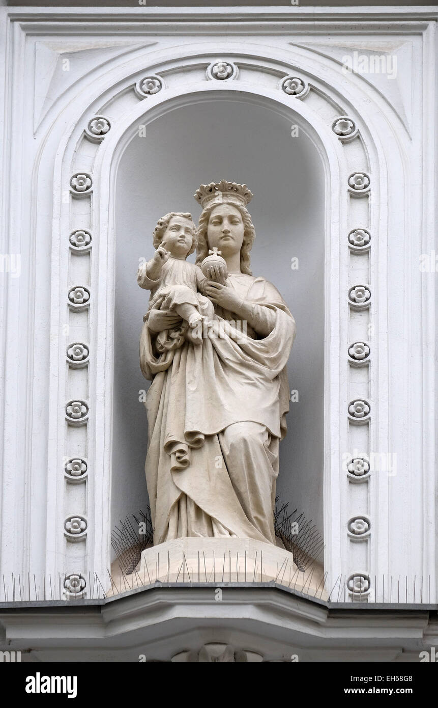 Virgin Mary with baby Jesus, statue on the house facade in Graz, Styria ...