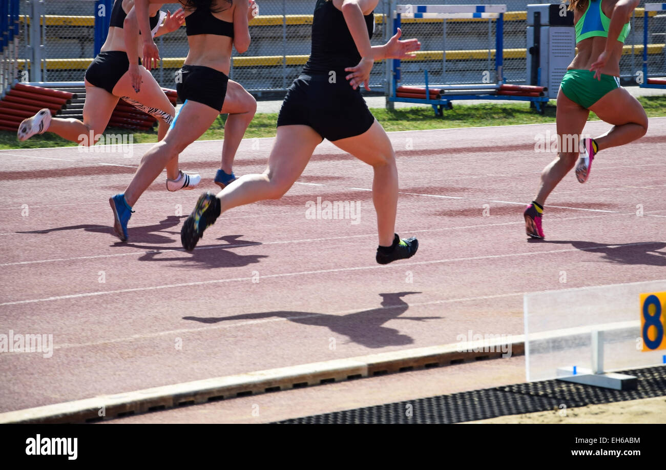 Women runners on the running track Stock Photo - Alamy