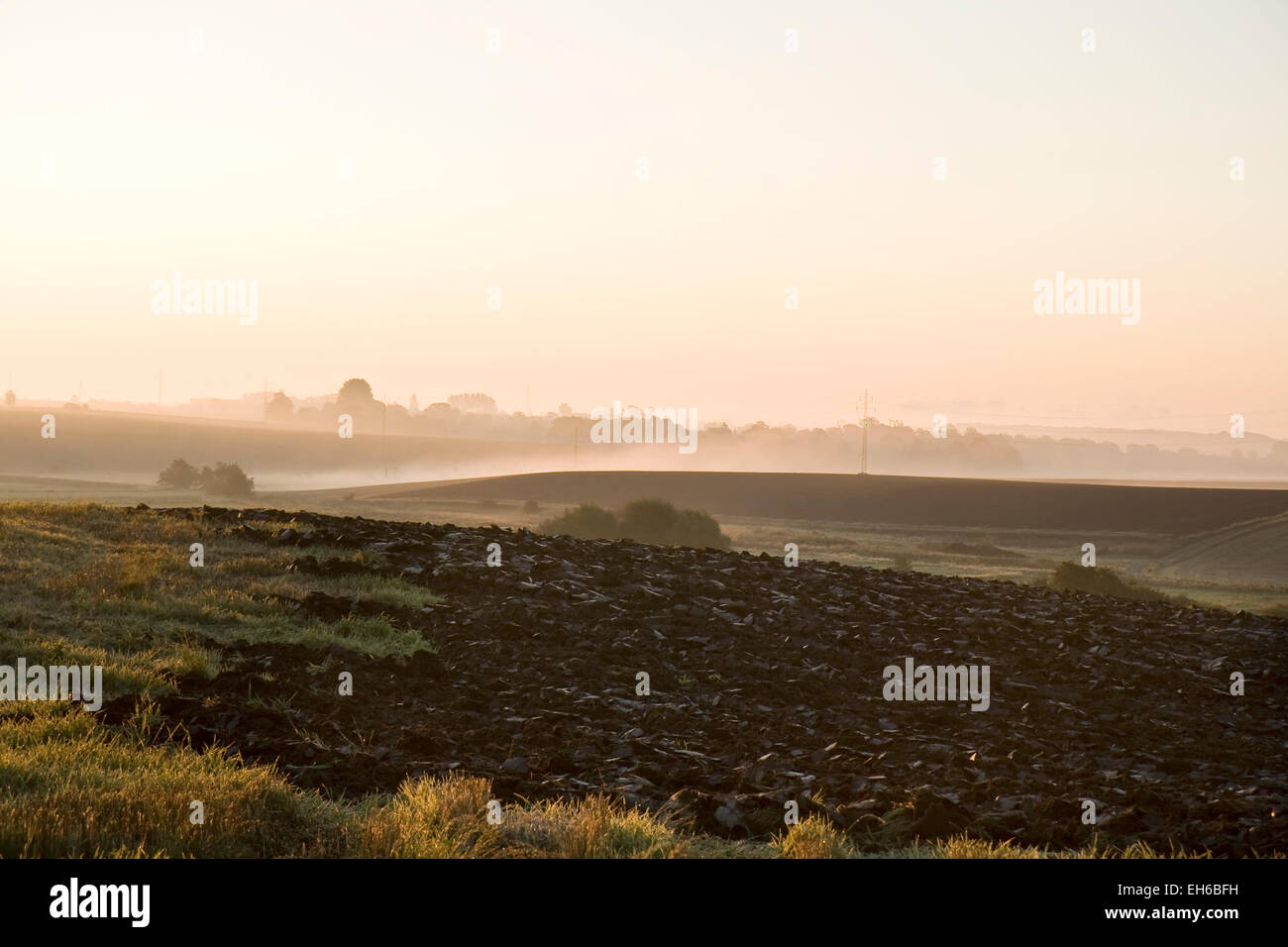 Morning mist over a ploughed field. Can be used as background Stock ...