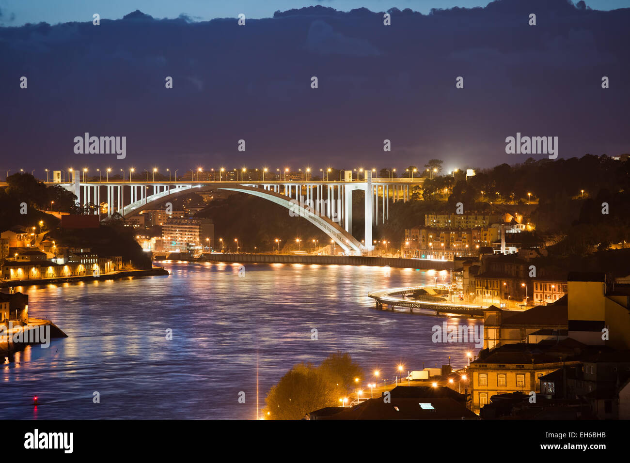 Arrabida Bridge at night over douro river, between cities of Porto and ...