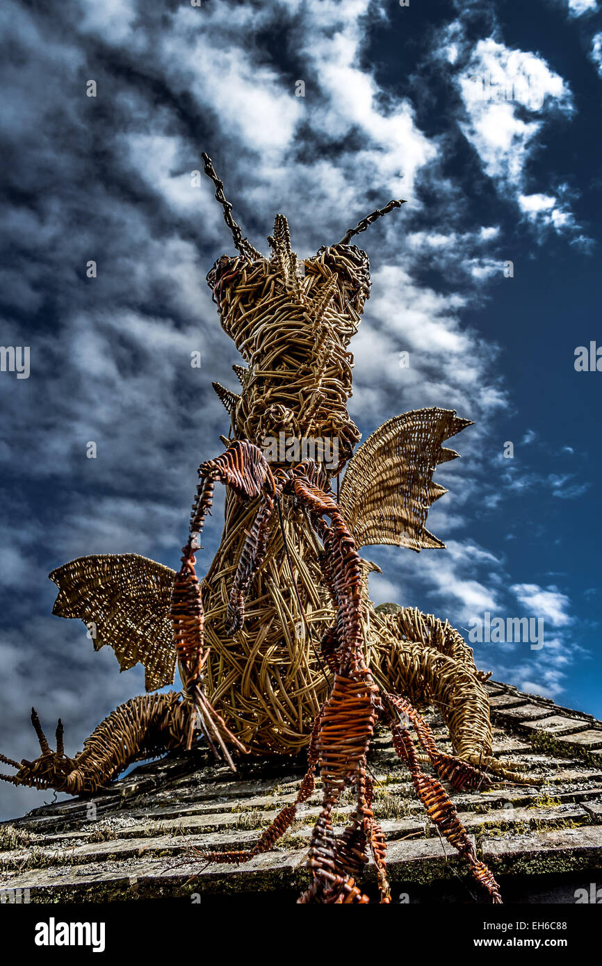wicker dragon on garden shelter roof Stock Photo - Alamy