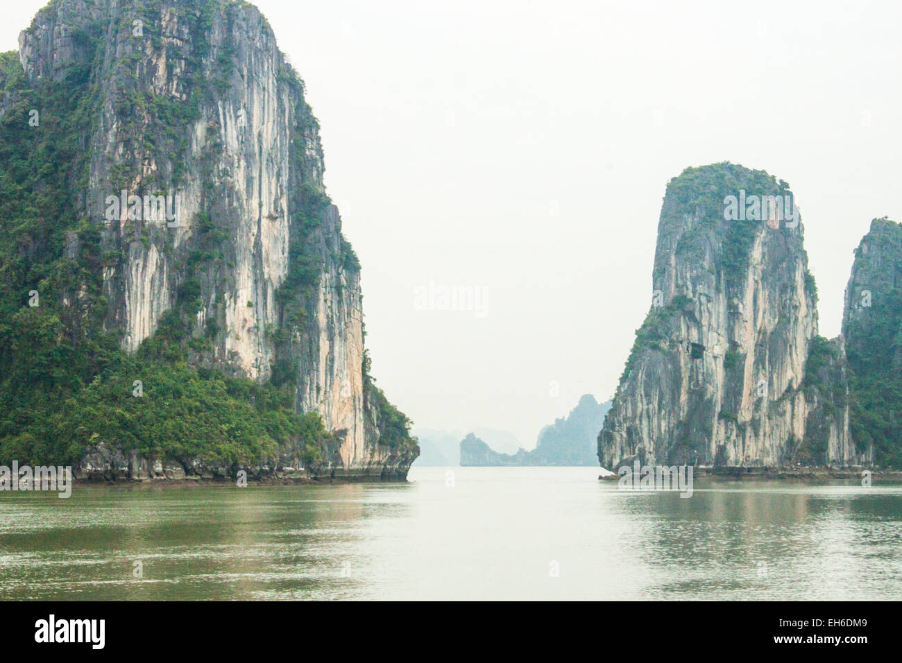 A view of cliffs at cloudy halong bay Stock Photo - Alamy