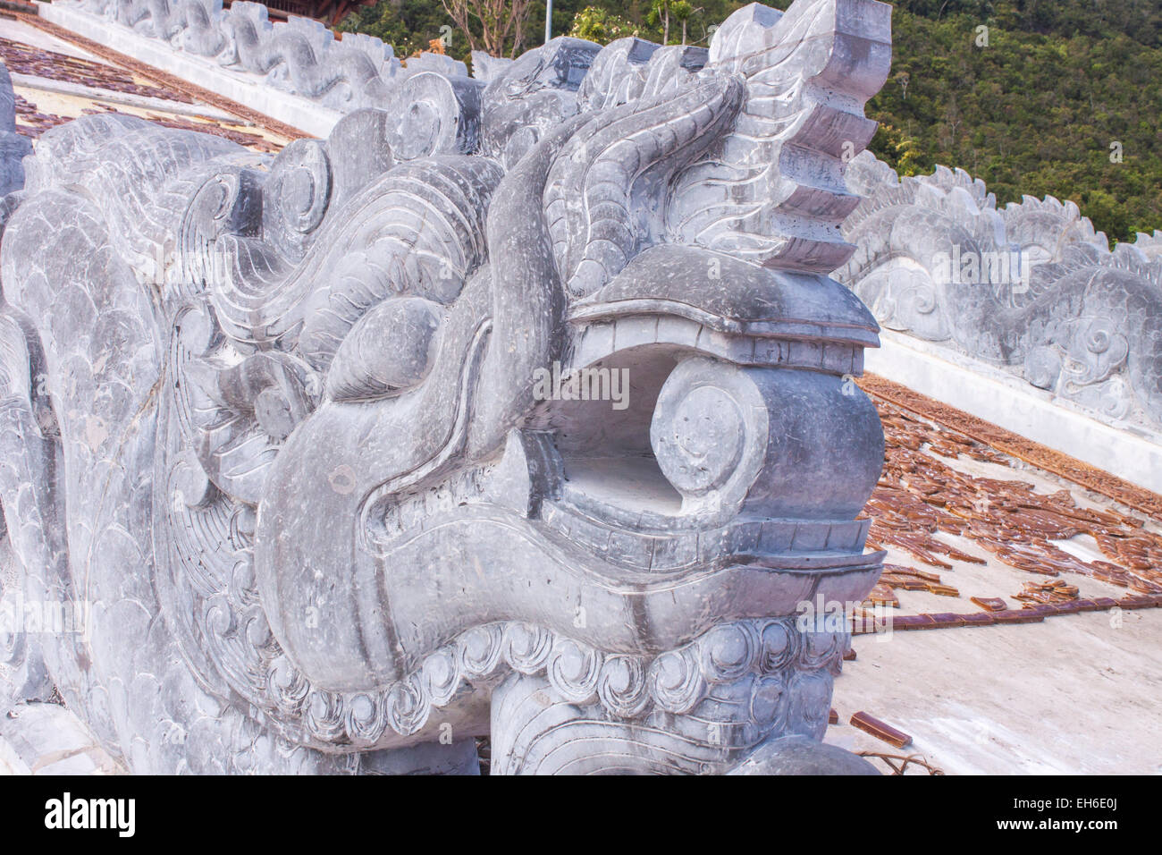 A dragon statue made of stone , at a temple Stock Photo - Alamy