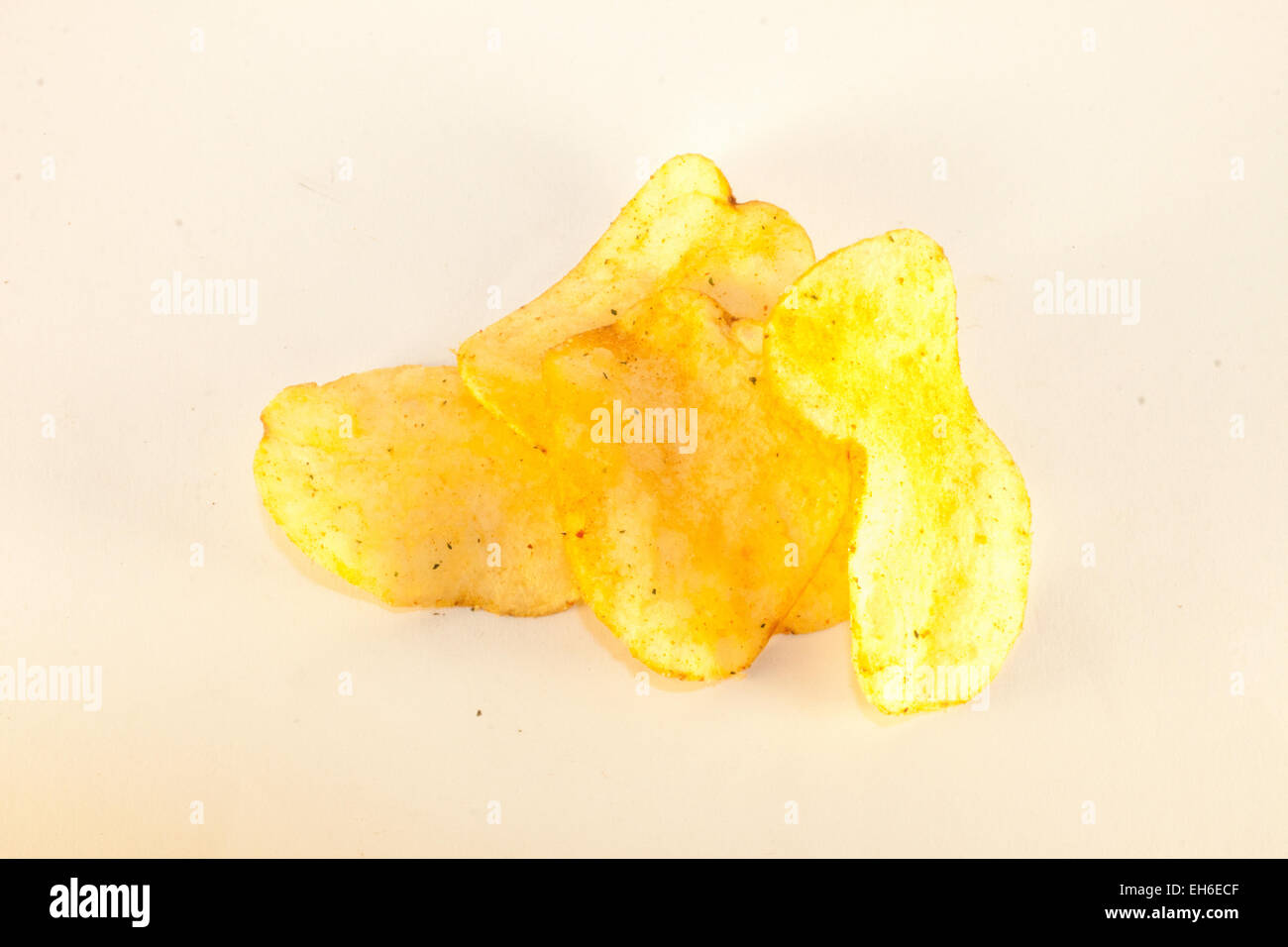 Yelllow potato chips, isolated on white background Stock Photo - Alamy