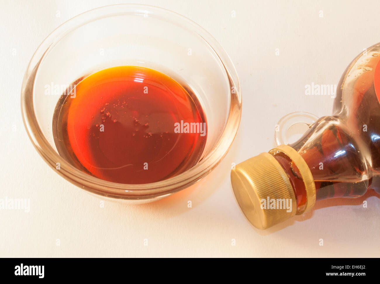 Brown maple syrup, isolated on white background Stock Photo - Alamy
