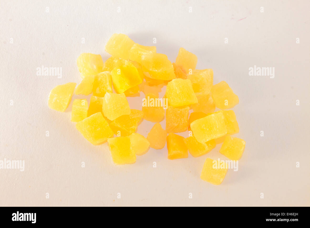 Dry pineapple dice, isolated on white background Stock Photo - Alamy