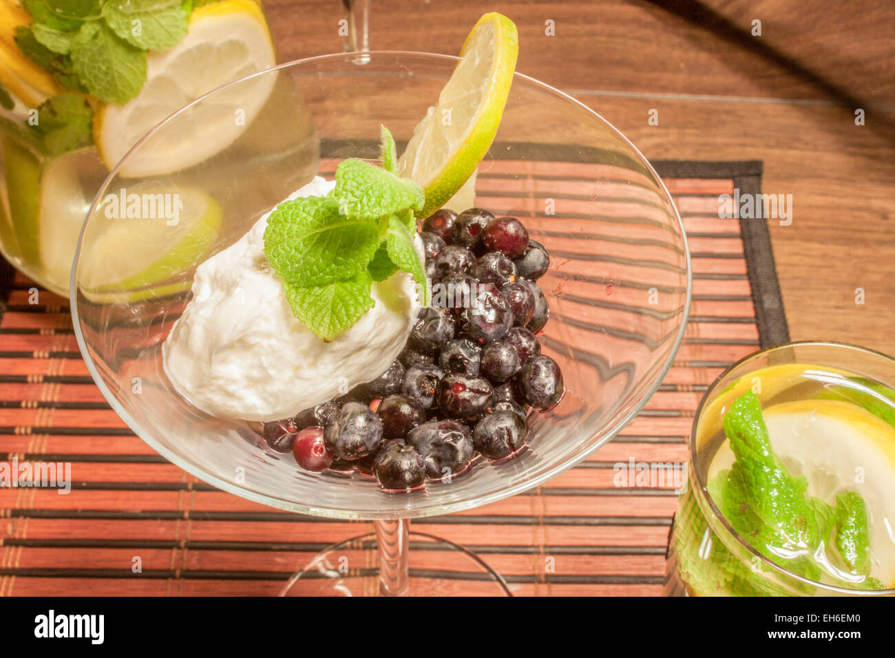 Blueberrys and quark with mint, standing in a glass on a tablet Stock ...