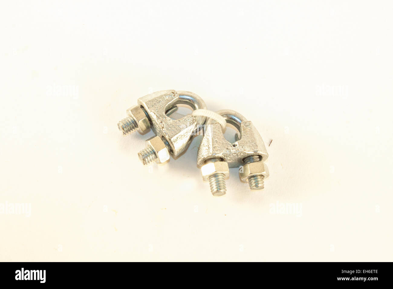 Silver cable fasteners, isolated on white background Stock Photo - Alamy