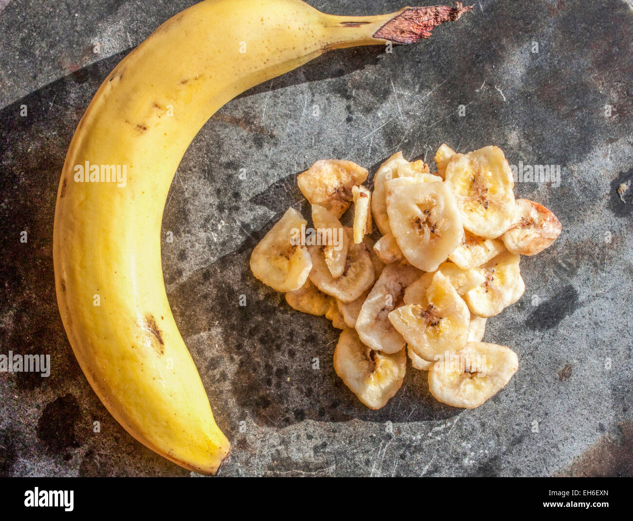 Dry and fresh banana, on a stone plate Stock Photo - Alamy