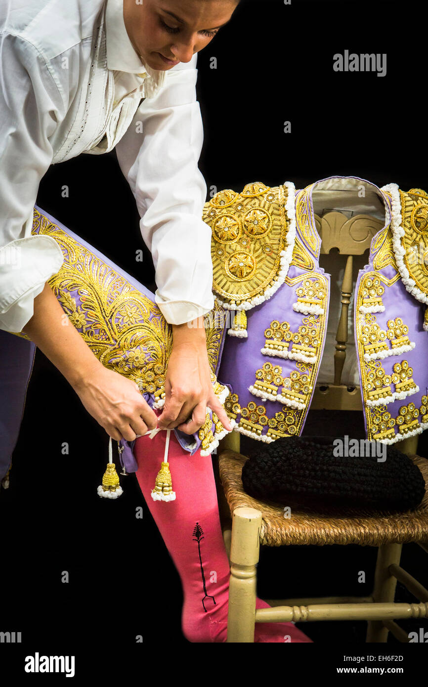 Woman bullfighter by dressing with vest on a black background Stock ...
