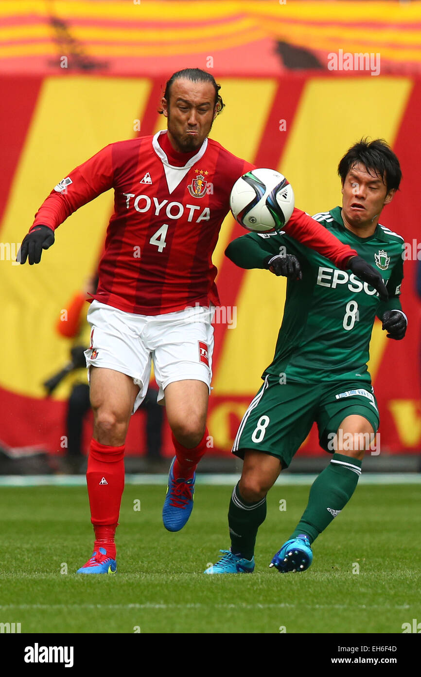 TOYOTA Stadium, Aichi, Japan. 7th Mar, 2015. (L-R) Marcus Tulio Tanaka (Grampus), Yuzo Iwakami ...