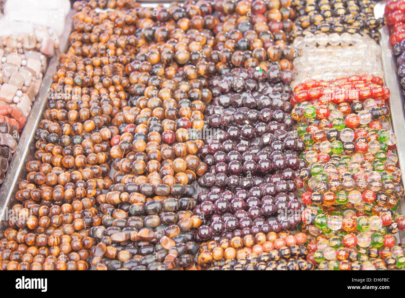 A bunch of colorful bracelet, at a market Stock Photo - Alamy