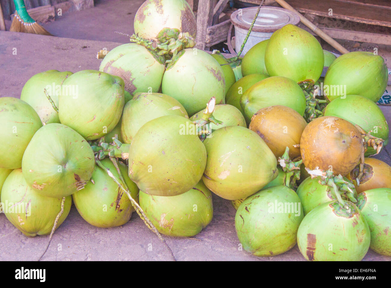 A big pile of green coconut, at a market Stock Photo - Alamy