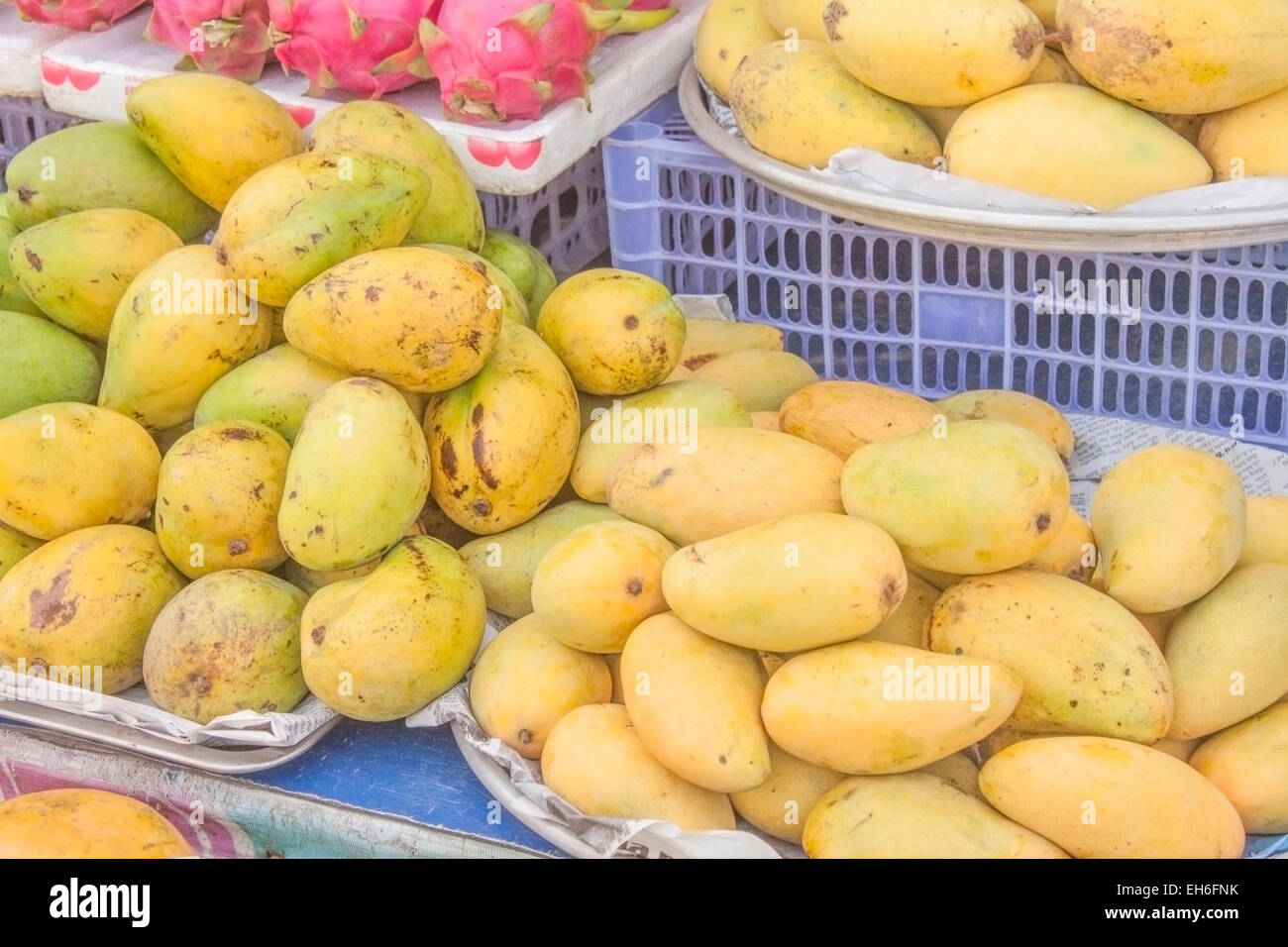 A lot of colorful mango, at a market Stock Photo - Alamy