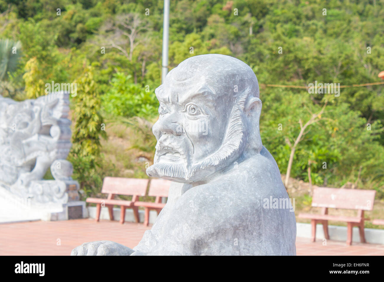 A stone statue, of a vietnamese old man Stock Photo - Alamy