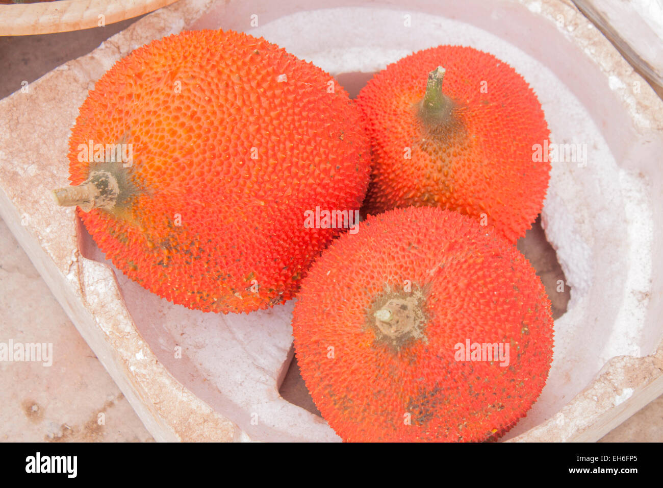 A few red gourd or gac fruits, at a market Stock Photo - Alamy