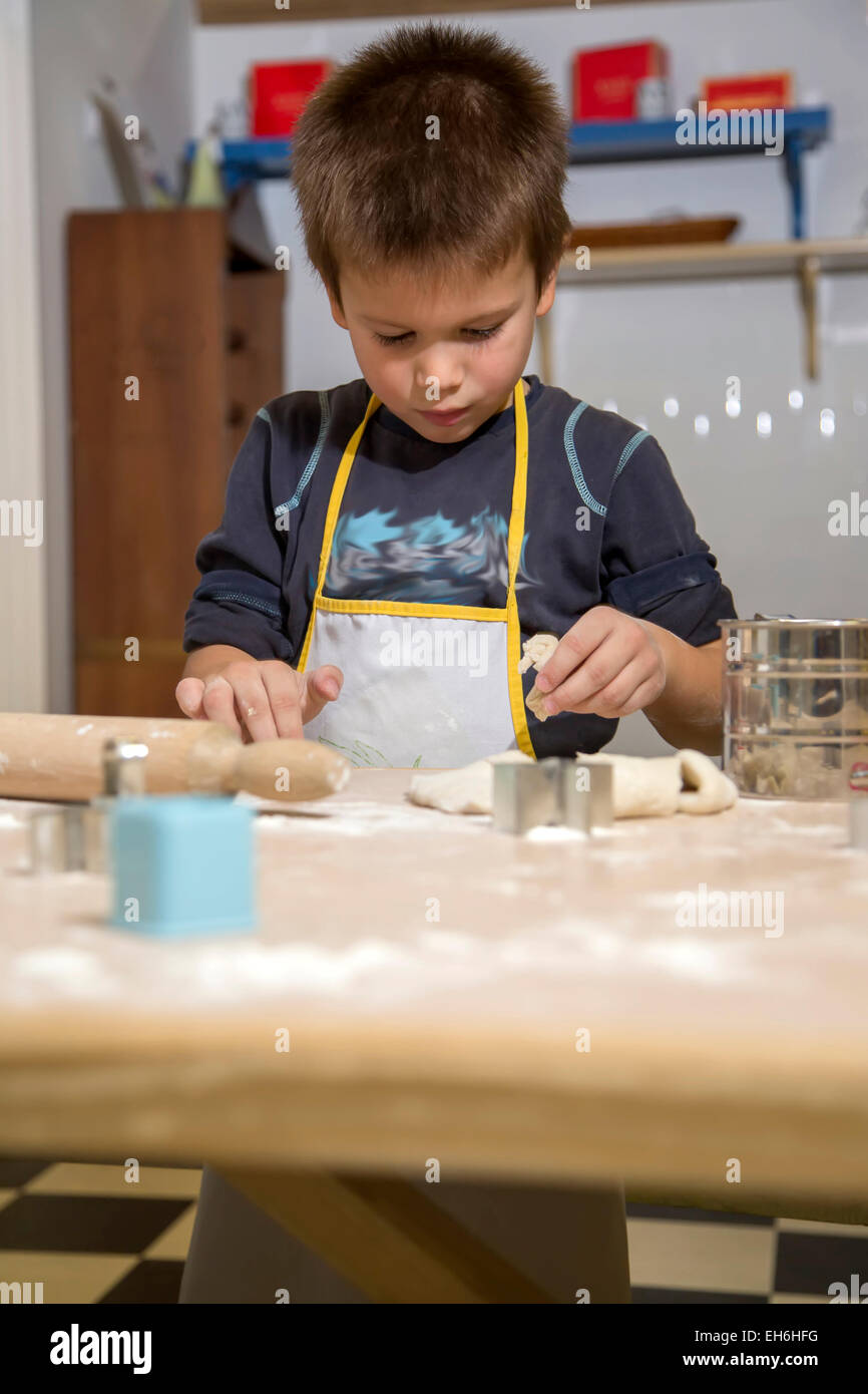 Boy making cakes in the kichen Stock Photo - Alamy