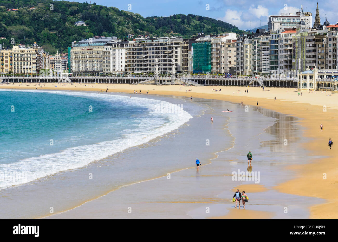 La Concha beach walkers on the Playa de la Concha, San Sebastian, Spain ...