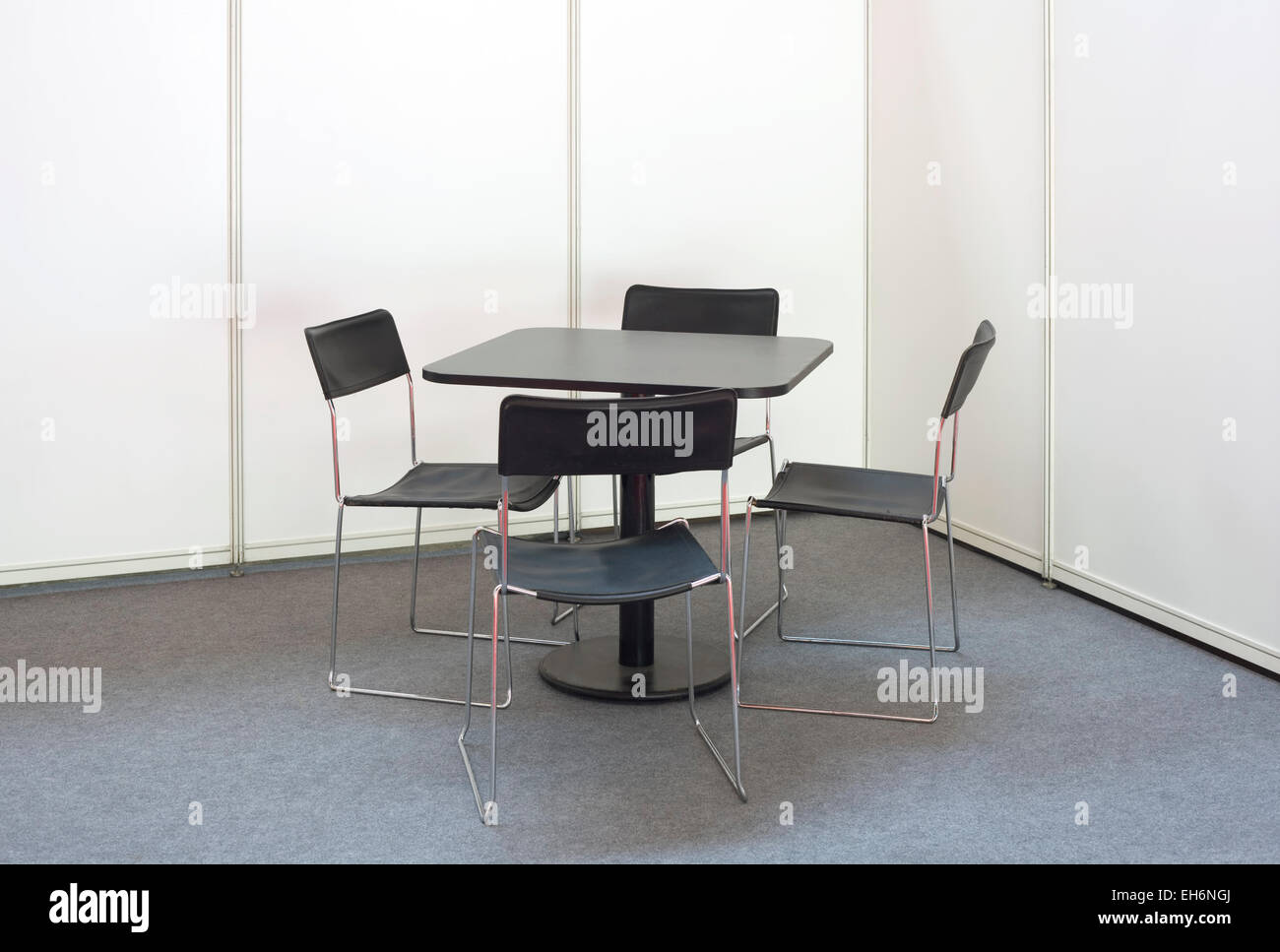Simple Desk and Four Chairs Stock Photo - Alamy