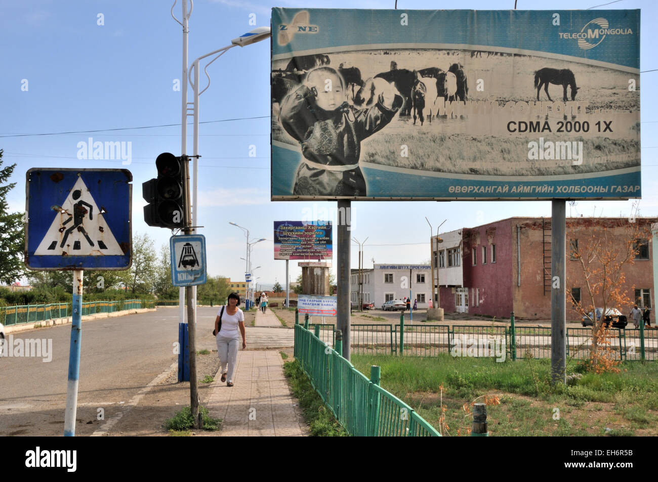 Arvaikheer, Street Poster on with boy and horses Stock Photo - Alamy