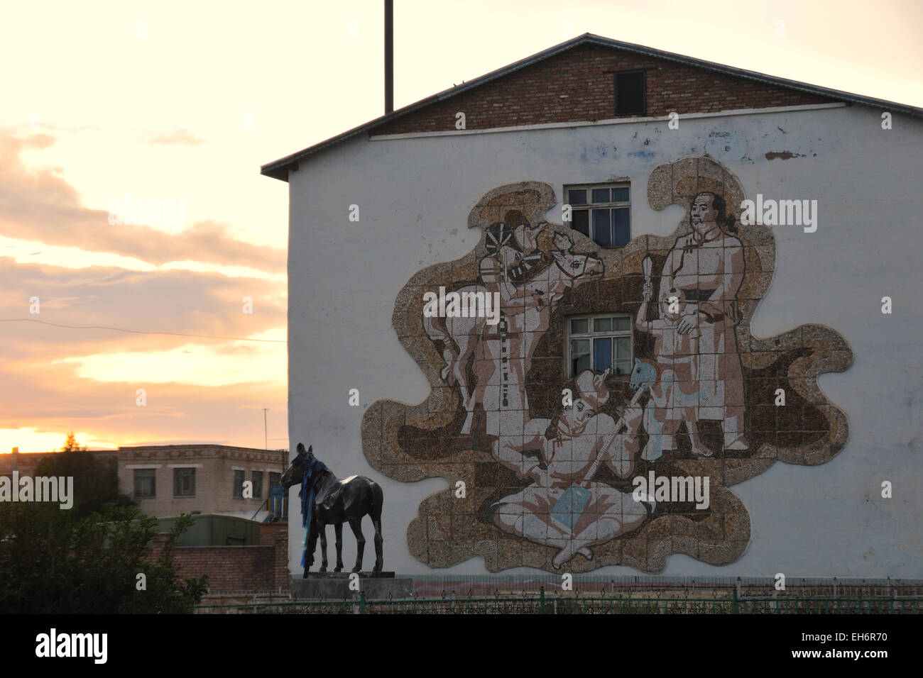 Arvaikheer, Sunset On Soviet Era Building With Fresco And Horse Statue ...