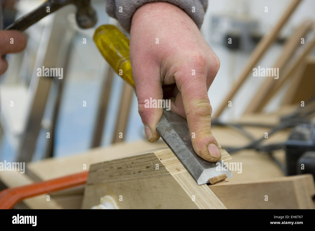 craftsmen work in a woodworking factory preparing high quality ...