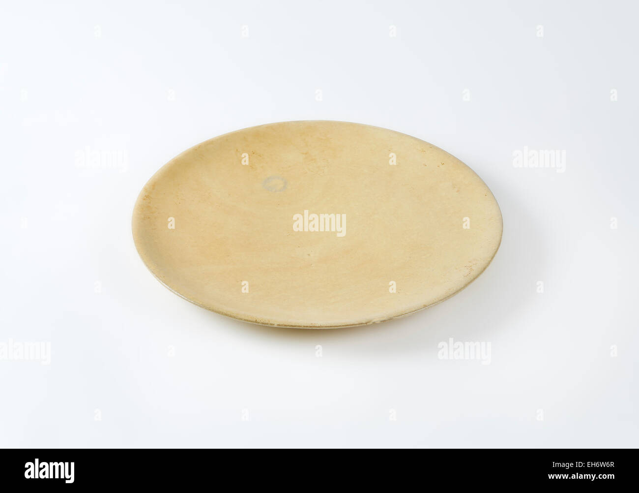 Beige flat rimless dinner plate Stock Photo - Alamy