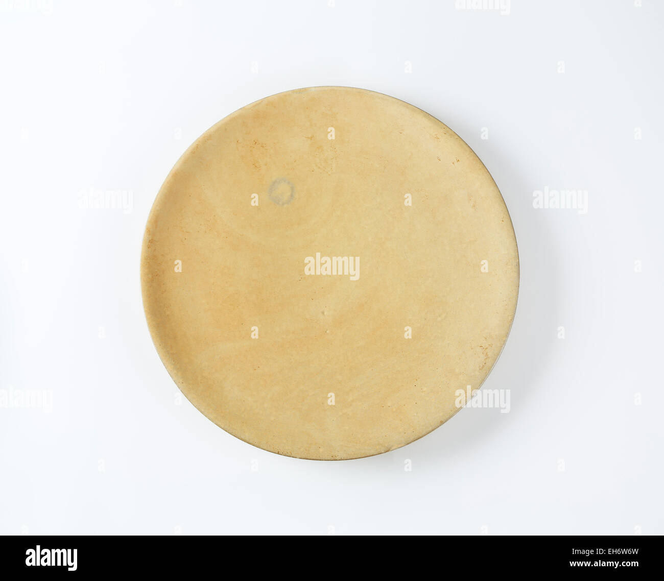 Beige flat rimless dinner plate Stock Photo - Alamy