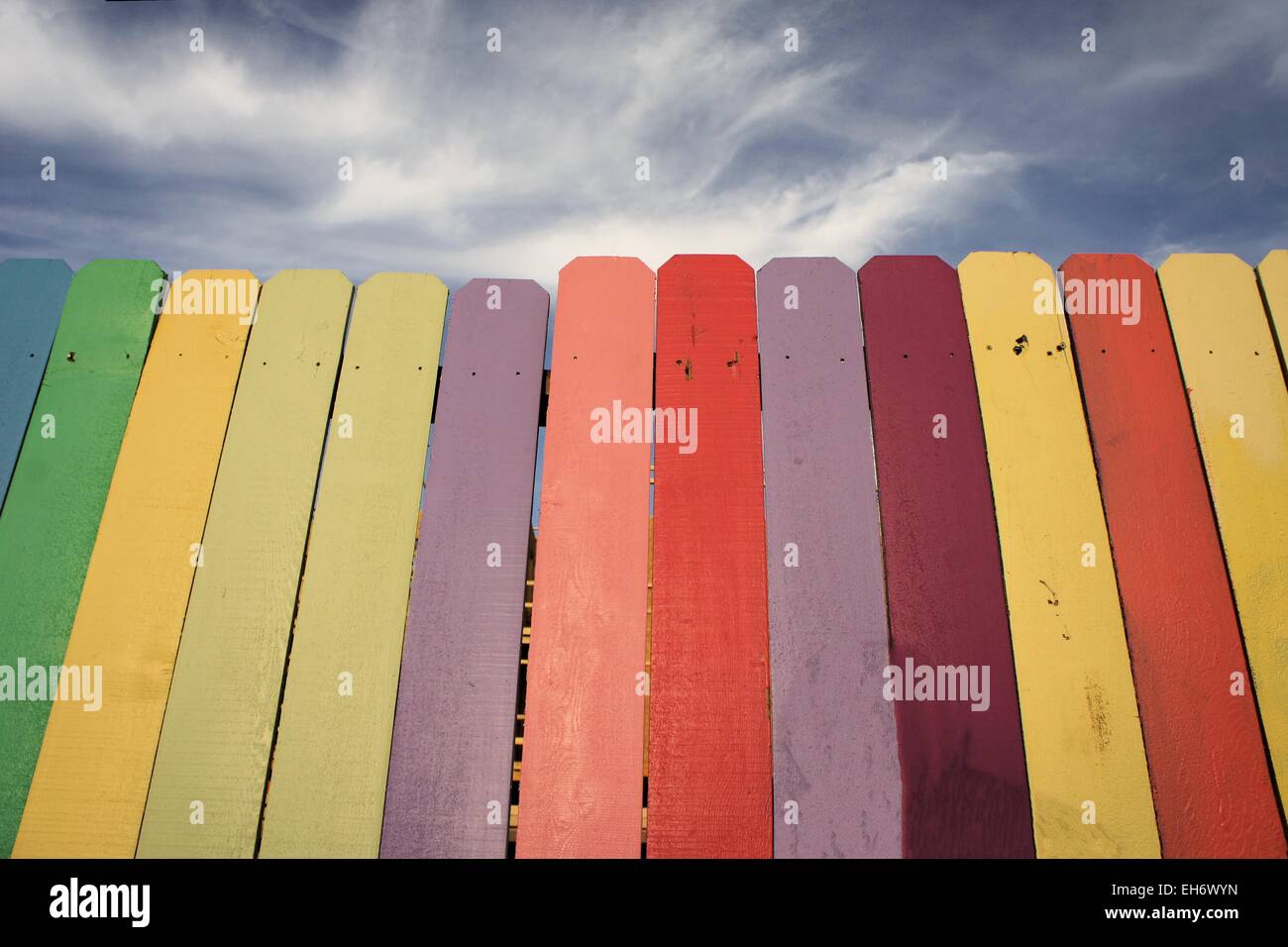 Wooden Rainbow Fence with blue sky Stock Photo - Alamy