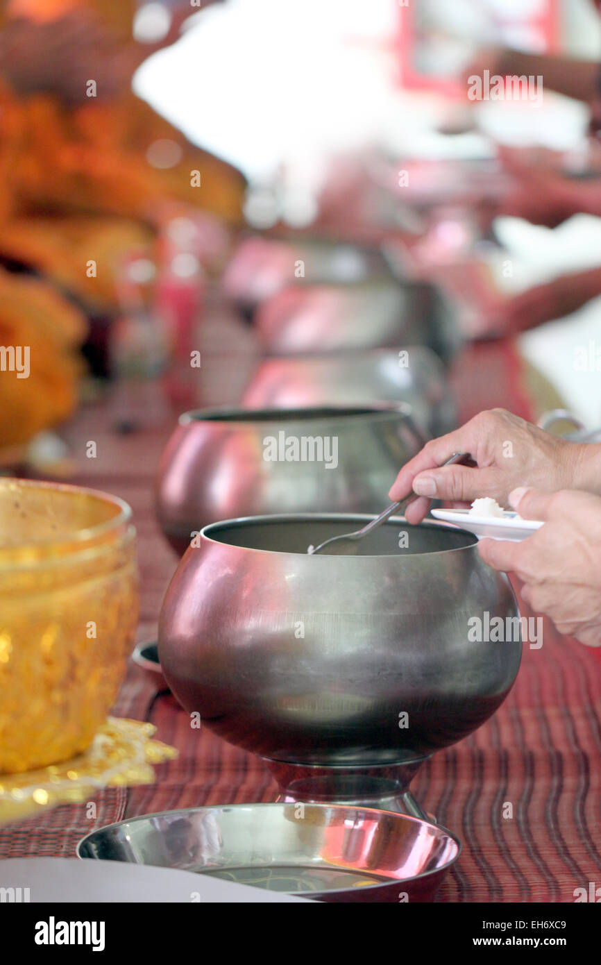 Giving for monks in ritual religion Thailand Stock Photo - Alamy