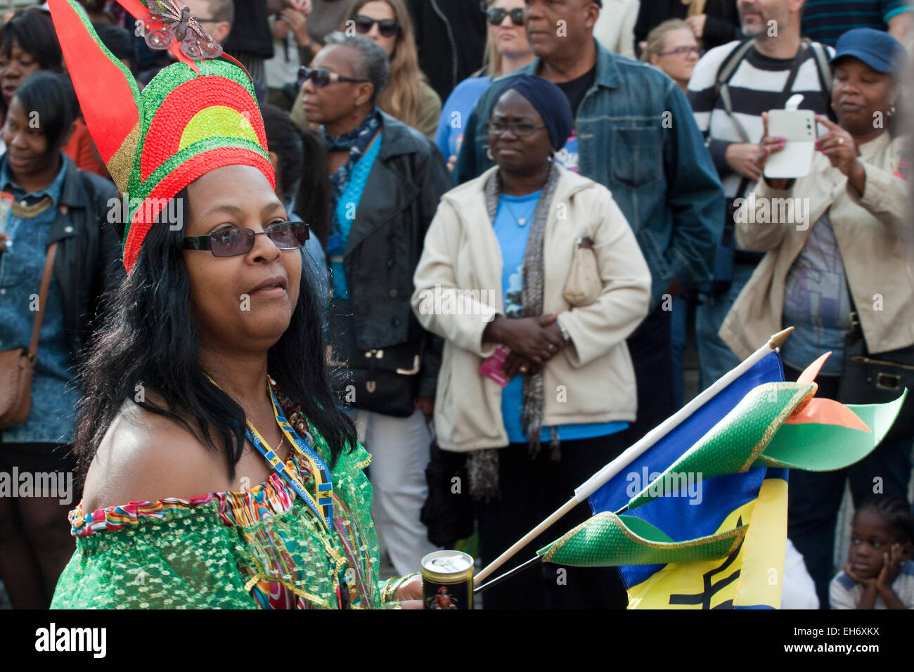 Afro Caribbean woman in carnival parade in a particularly colourful ...