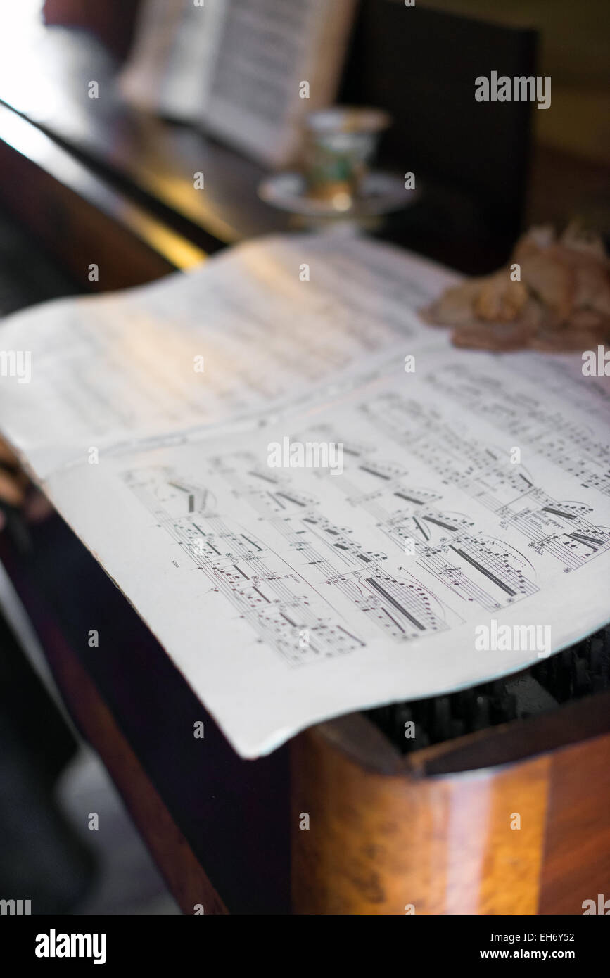 Vintage photo of old piano with notes Stock Photo - Alamy