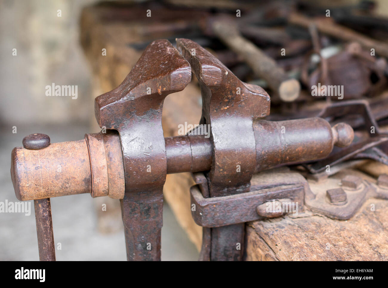Vintage vise on the working table Stock Photo - Alamy