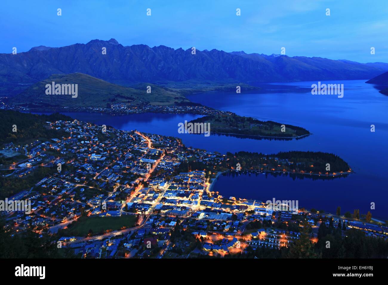 aerial view of Queenstown at dusk with the remakable range and lake ...