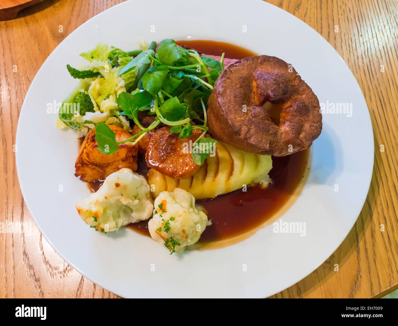 Sunday Lunch main course Roast Beef Yorkshire pudding vegetables and ...