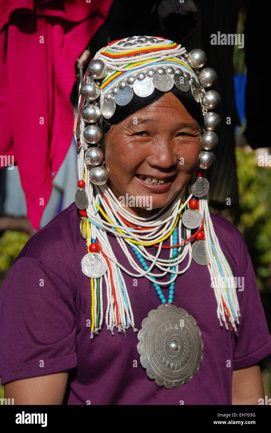 Ahka Village, Lady with traditional silver hair dress with coins and ...
