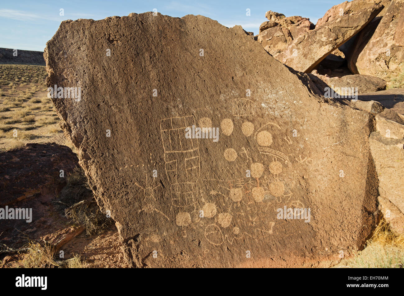 petroglyphs carved into volcanic tuff rock on the volcanic tableland ...