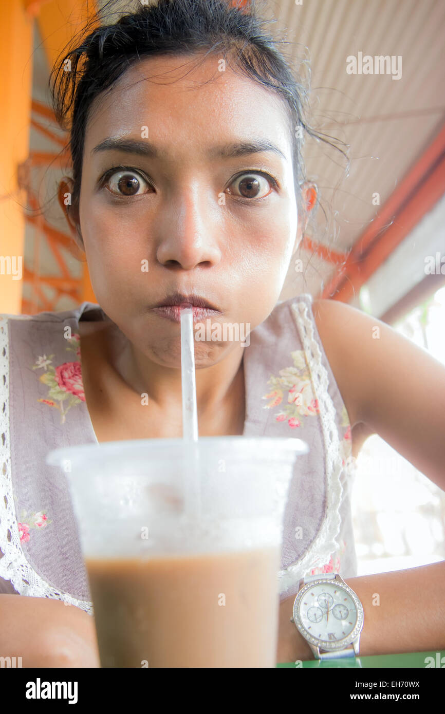 funny face girl drinks coffee Stock Photo - Alamy