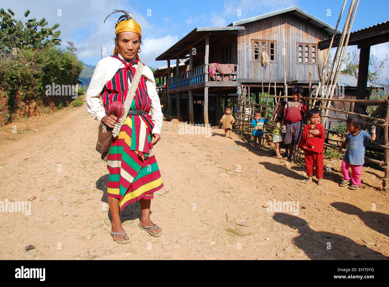 Tribal man wearing traditional costume in village street, Kanpetlet ...