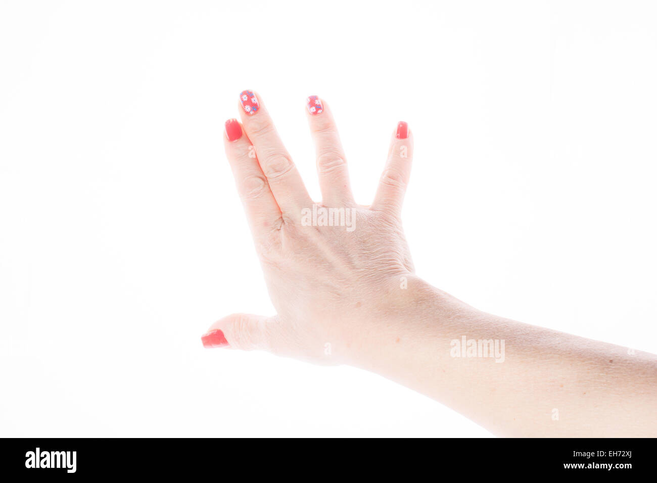 Female hand showing sign on a white background Stock Photo - Alamy