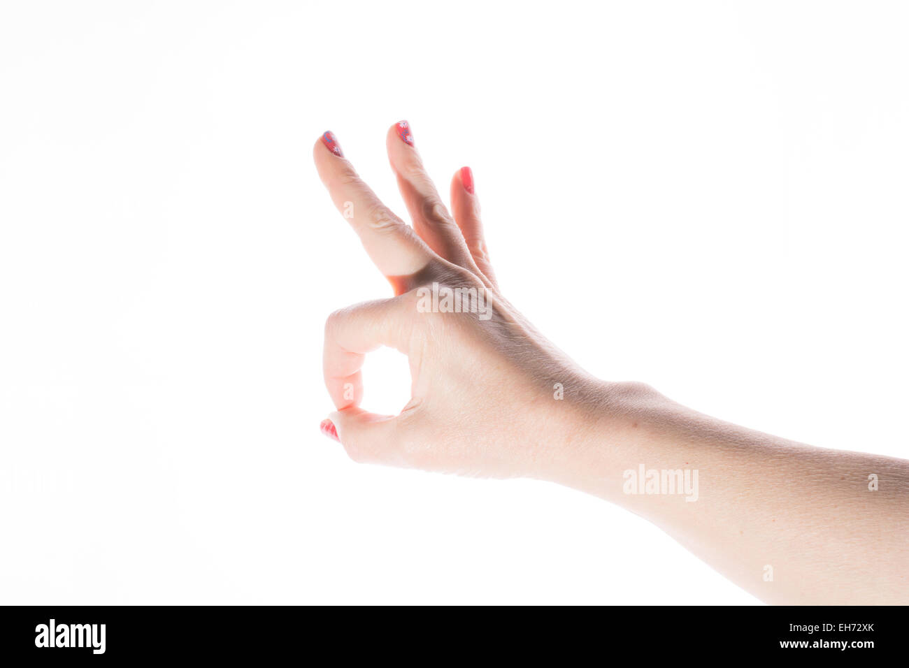 Female hand showing OK sign on a white background Stock Photo - Alamy