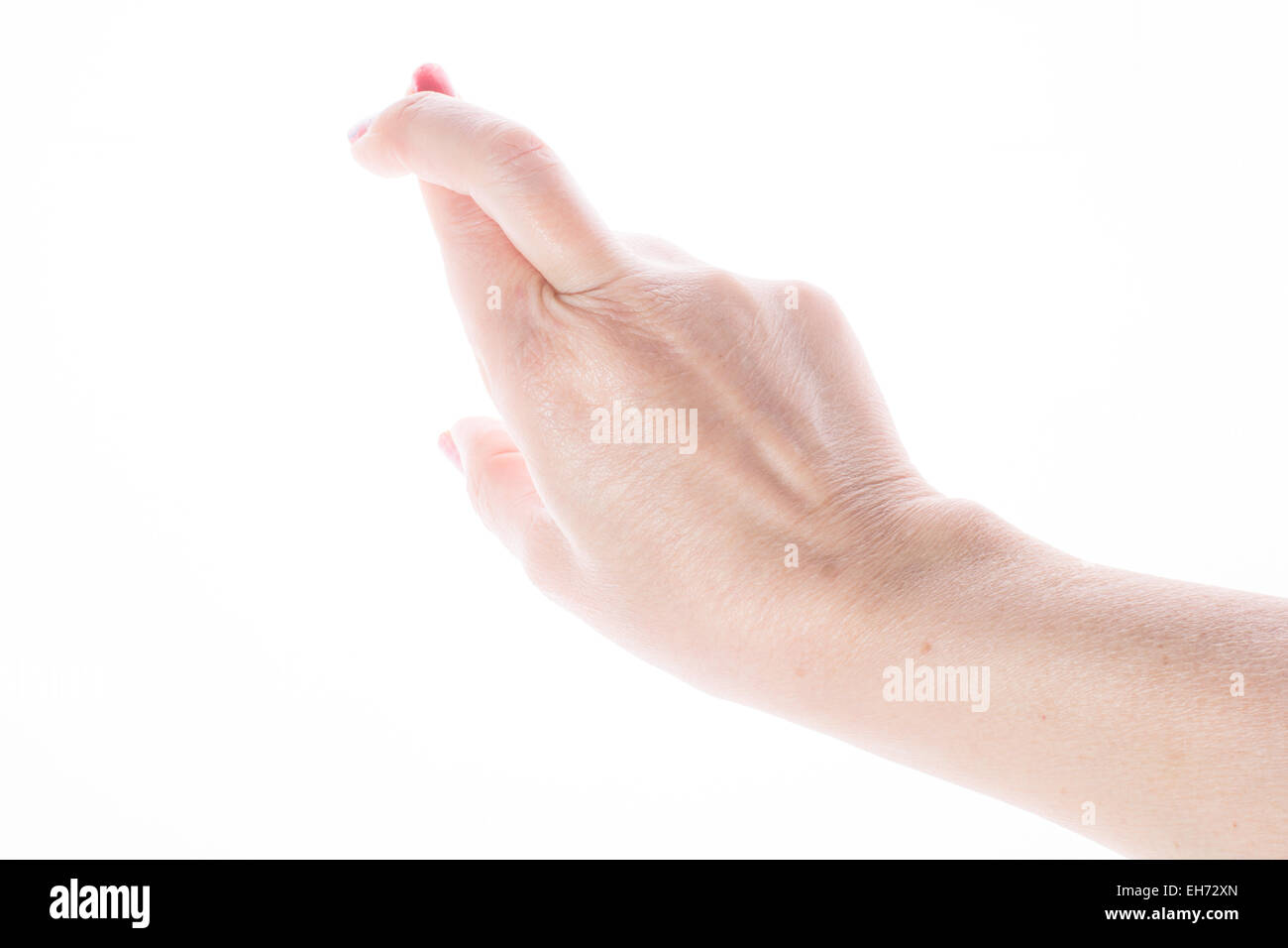 Female hand shows good luck sign on a white background Stock Photo - Alamy