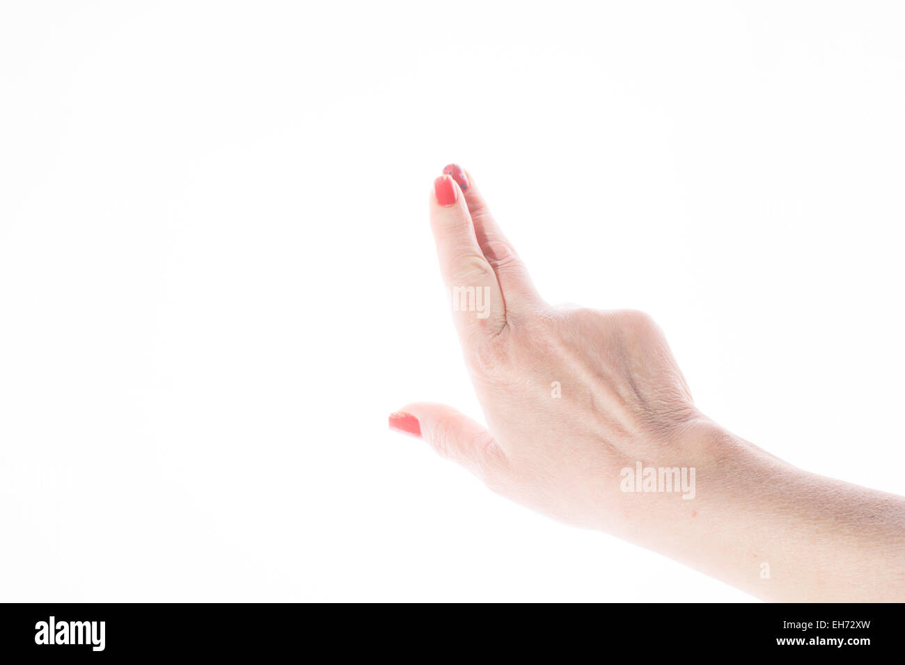 Female hand shows good luck sign on a white background Stock Photo - Alamy