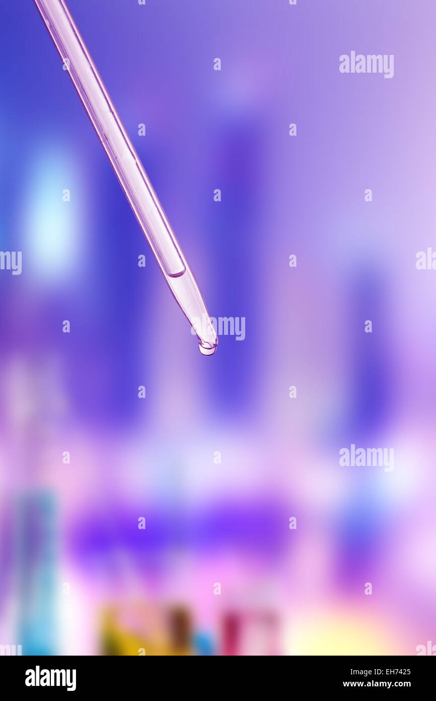 Pipette with blur laboratory background Stock Photo - Alamy