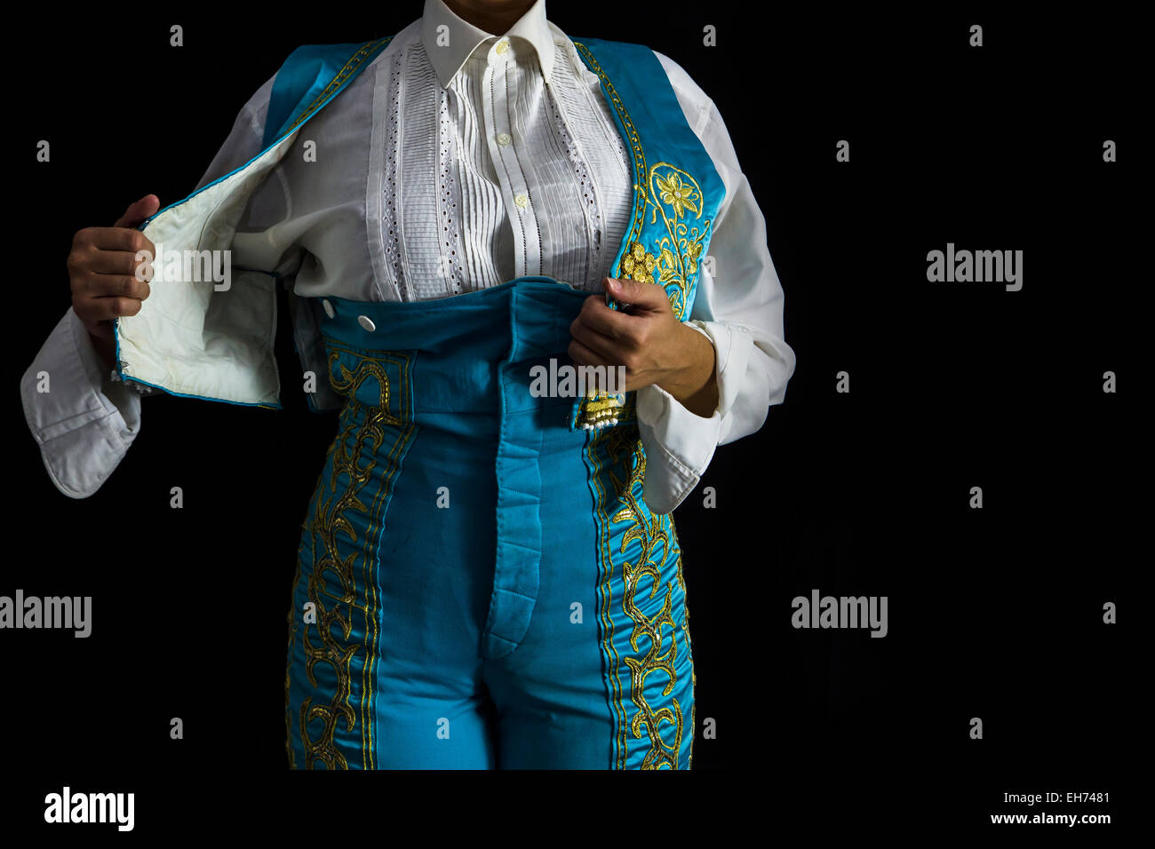 Woman bullfighter by dressing with vest on your back on a black ...