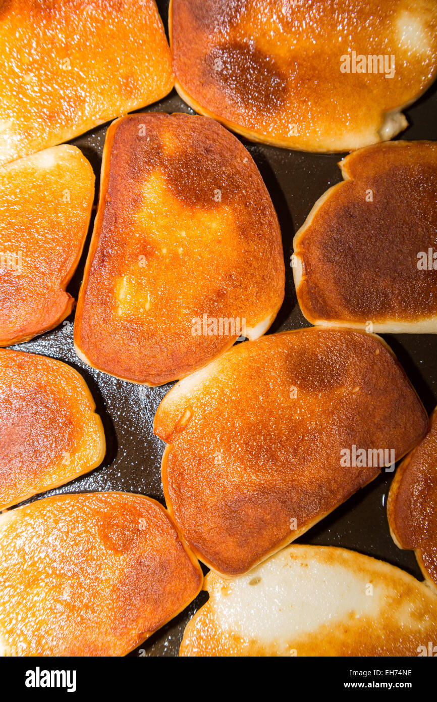 Picture of norwegian fish pudding slices in a frying pan Stock Photo ...