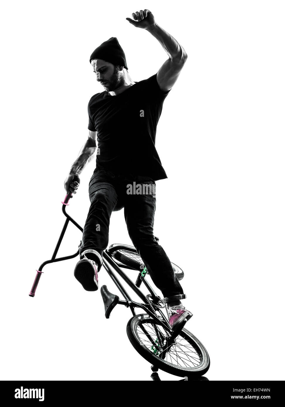 one man exercising bmx acrobatic figure in silhouette studio isolated ...